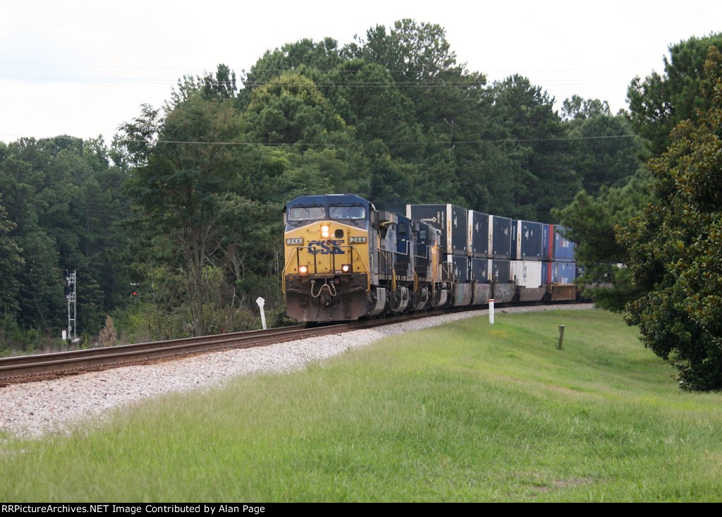 CSX AC44CW 244 leads sister-unit 279, C40-8W 7926, and UP SD70M 4294
